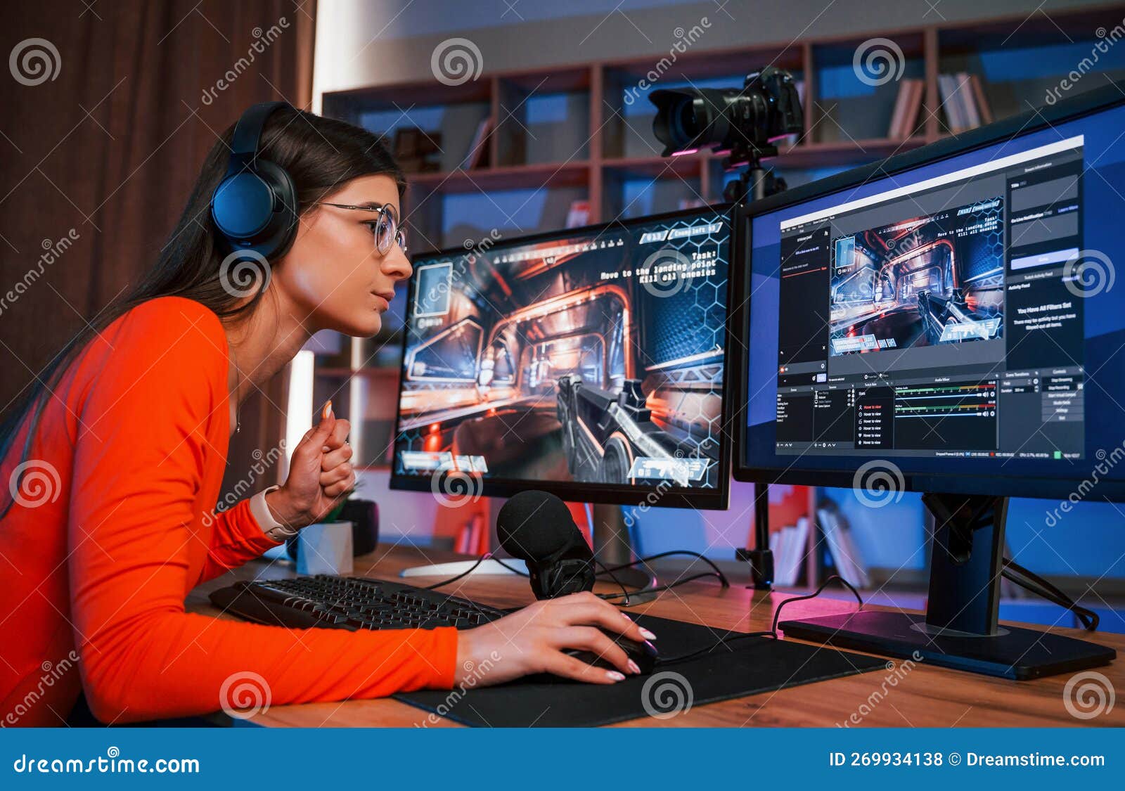 Focused on the Game Process. Young Beautiful Streamer is Indoors with ...