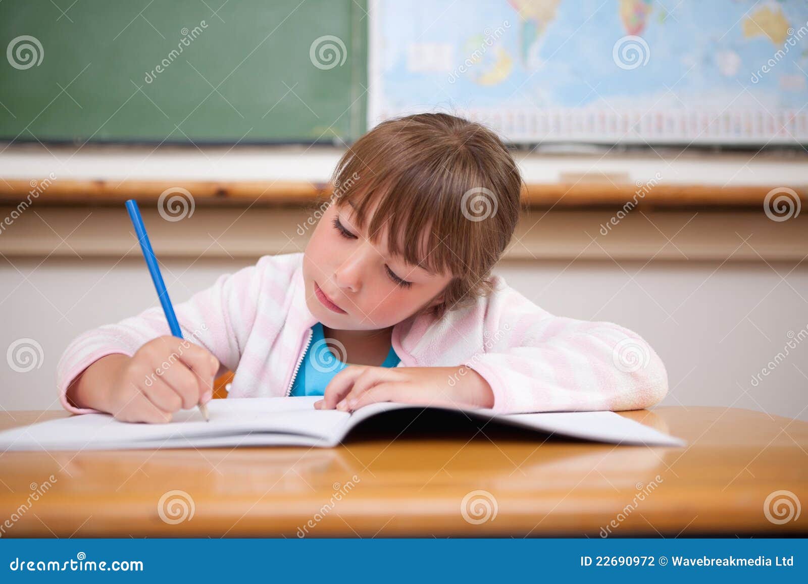Focused girl writing stock photo. Image of girl, class - 22690972