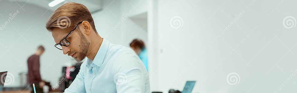 Focused Guy Working on a New Project in the Office Stock Photo - Image ...