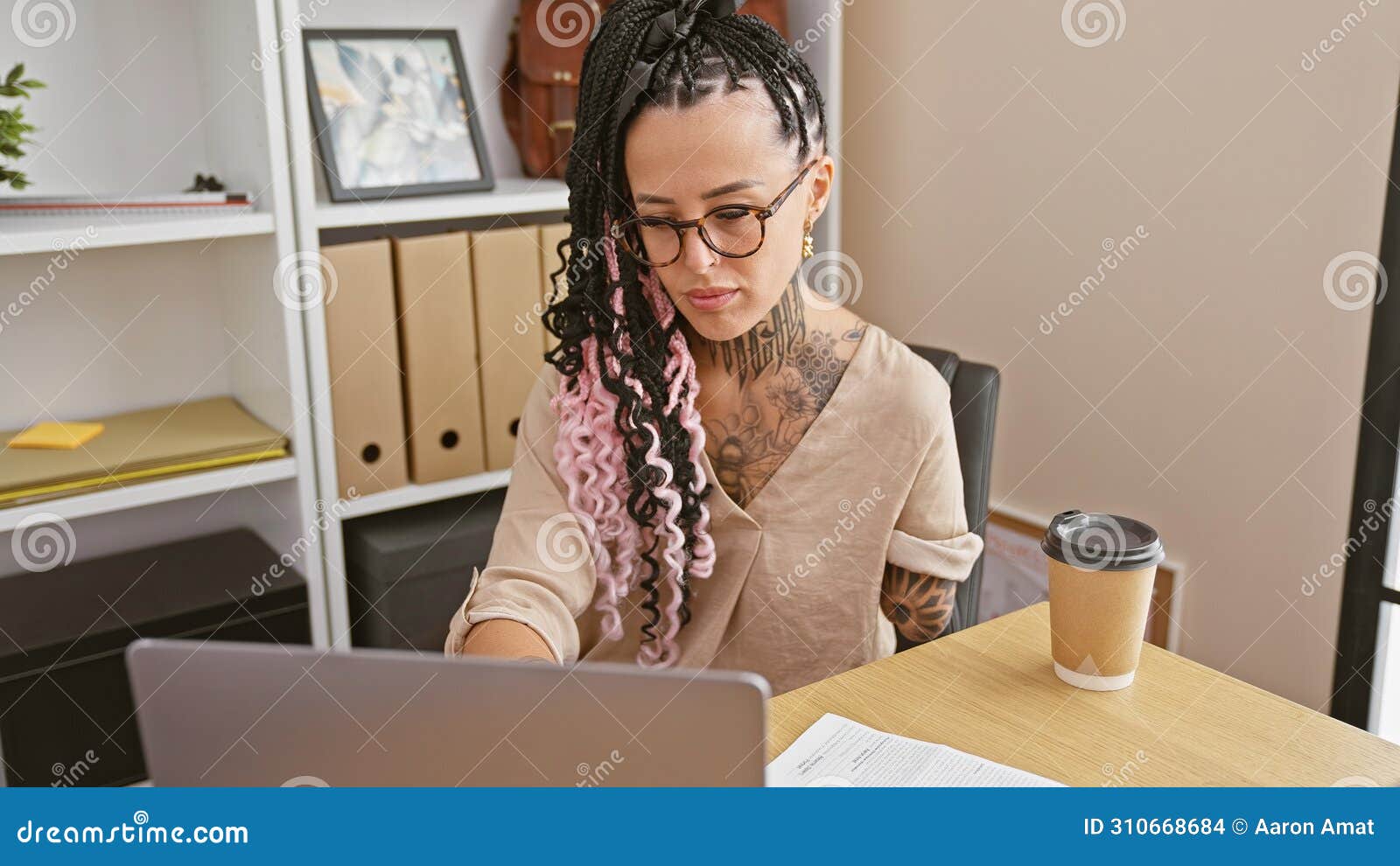 Focused Hispanic Business Woman, an Arm Amputee, Working Diligently on ... Focused Hispanic Business Woman, an Arm Amputee, Working Diligently on ...