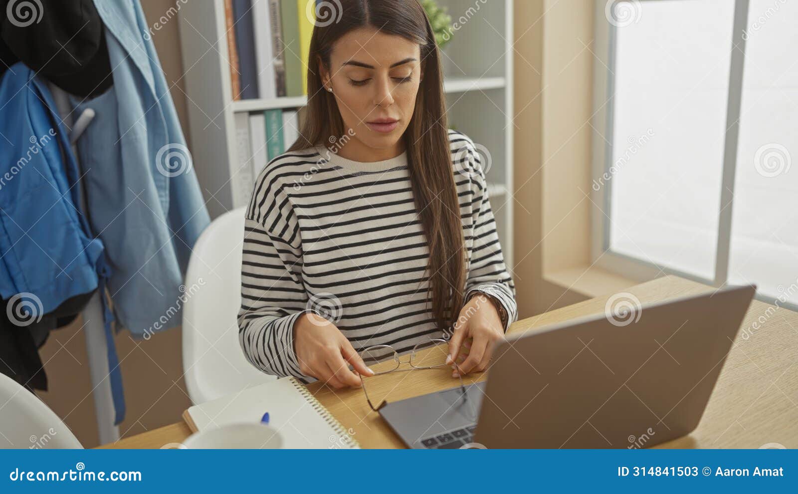 Focused Hispanic Woman Working on Laptop at Home Stock Image - Image of ...