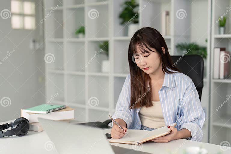 Focused Learner Engaged in Remote Class, Writing Notes Stock Photo ... Focused Learner Engaged in Remote Class, Writing Notes Stock Photo ...