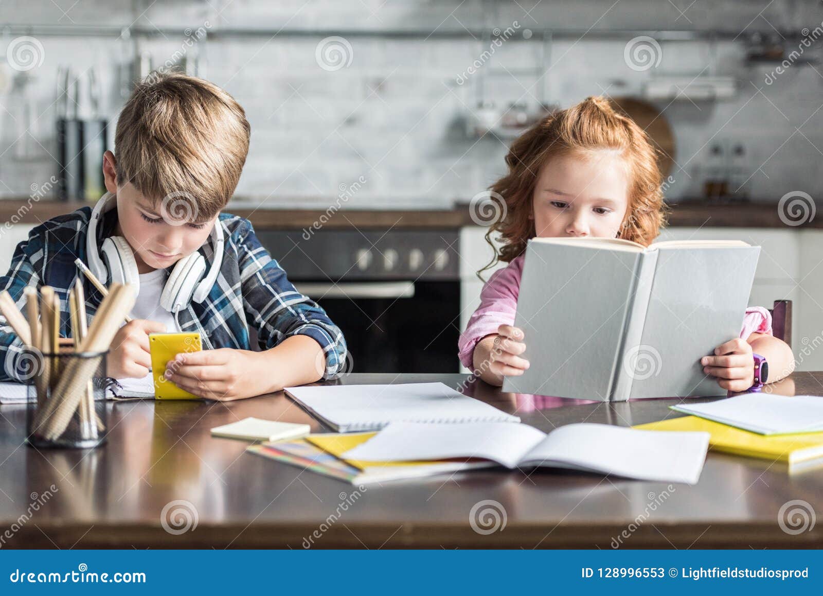 Focused Little Siblings Doing Homework Together Stock Image - Image of ...