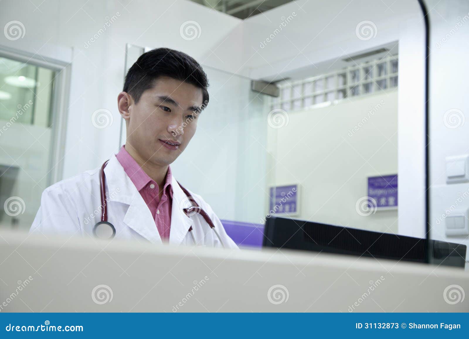 Focused Male Veterinarian Looking at Computer Screen Stock Image ...