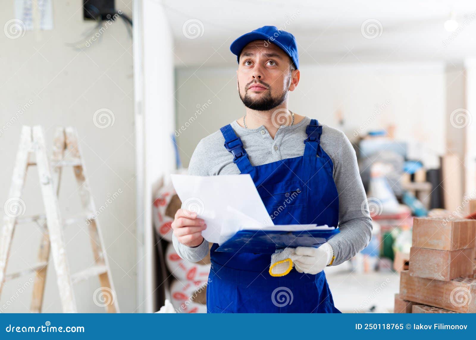 Foreman Reading Papers on Indoor Construction Site Stock Image - Image ...
