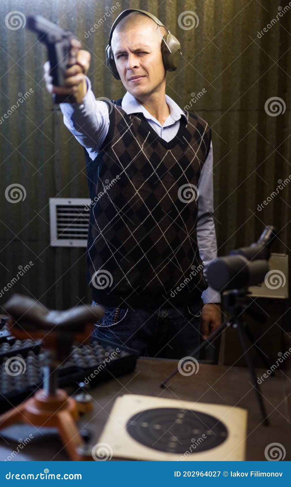 Man Aiming Smallbore Sporting Pistol At Target In Shooting Range Stock Image Image Of Practice