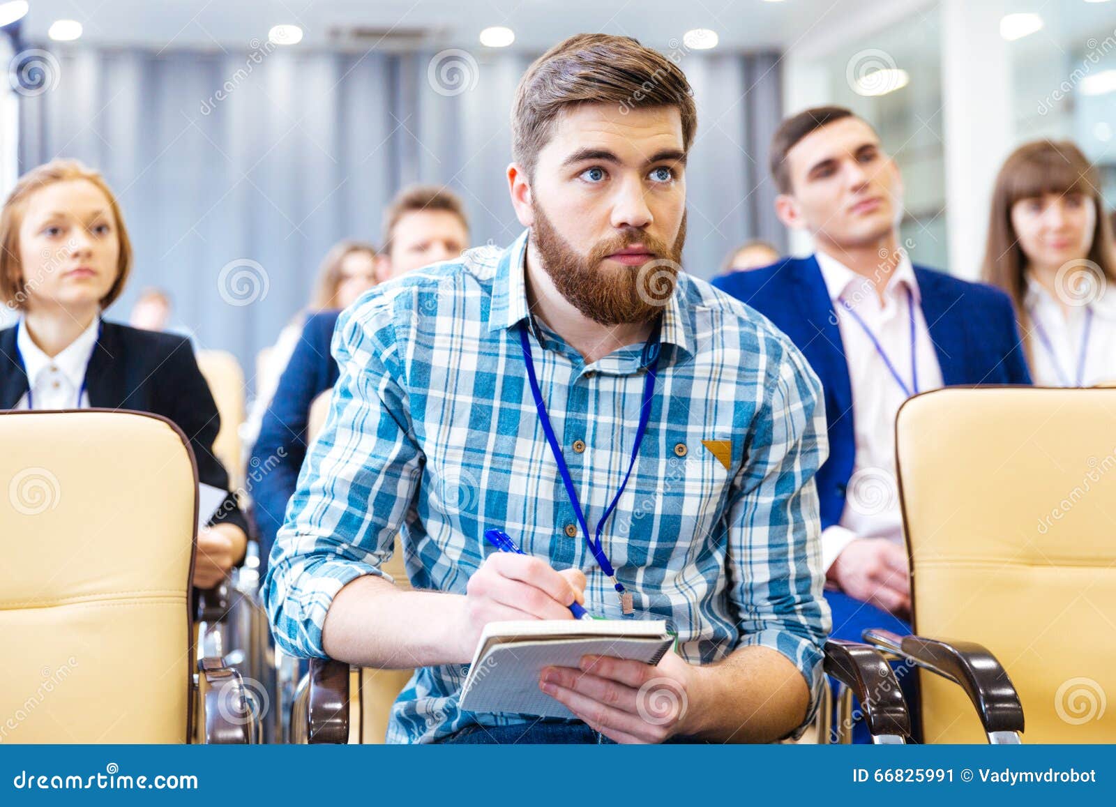 Focused Man Listening and Making Notes on Presentation Stock Image ...