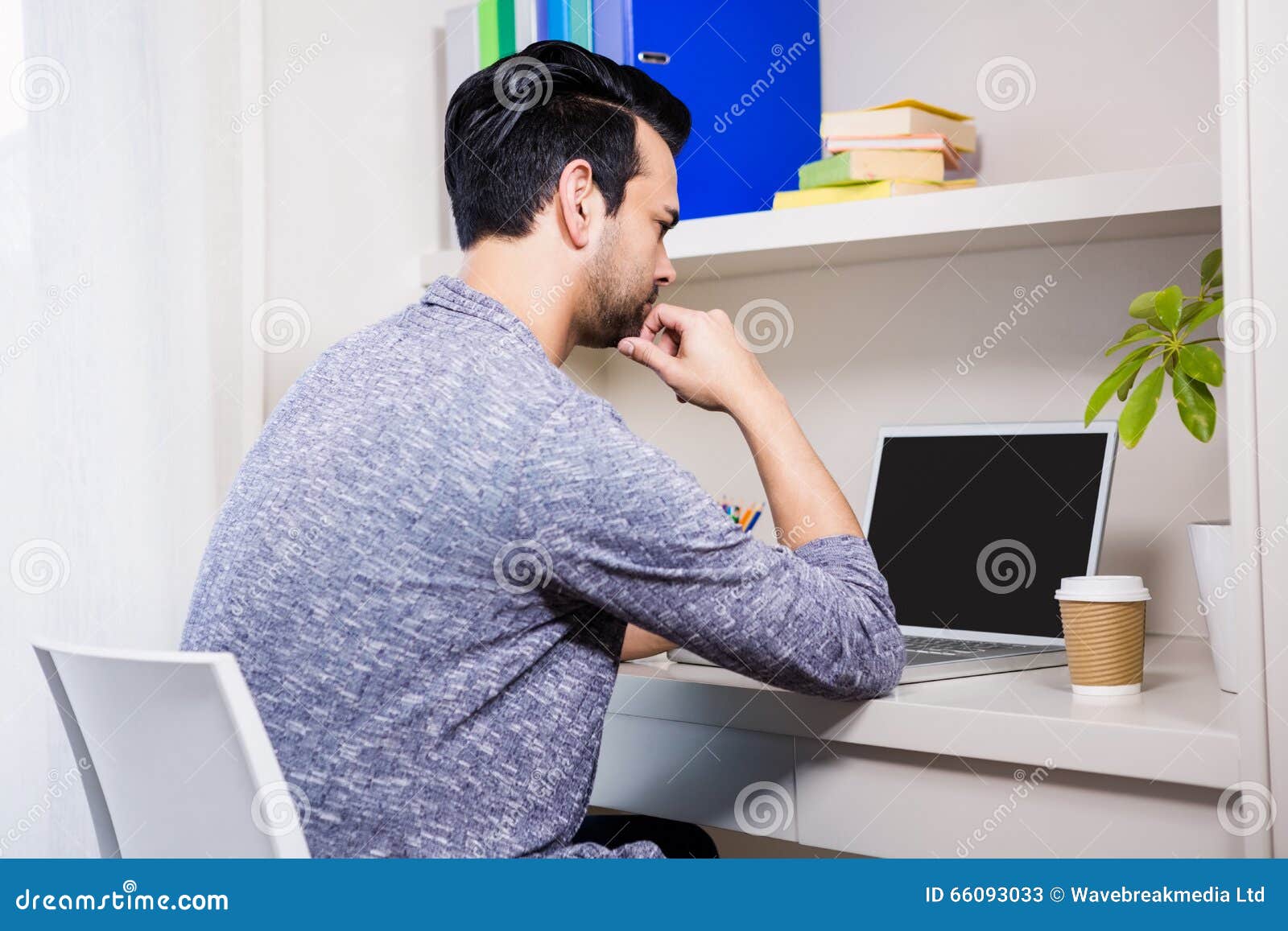 Focused man using laptop stock image. Image of gesturing - 66093033