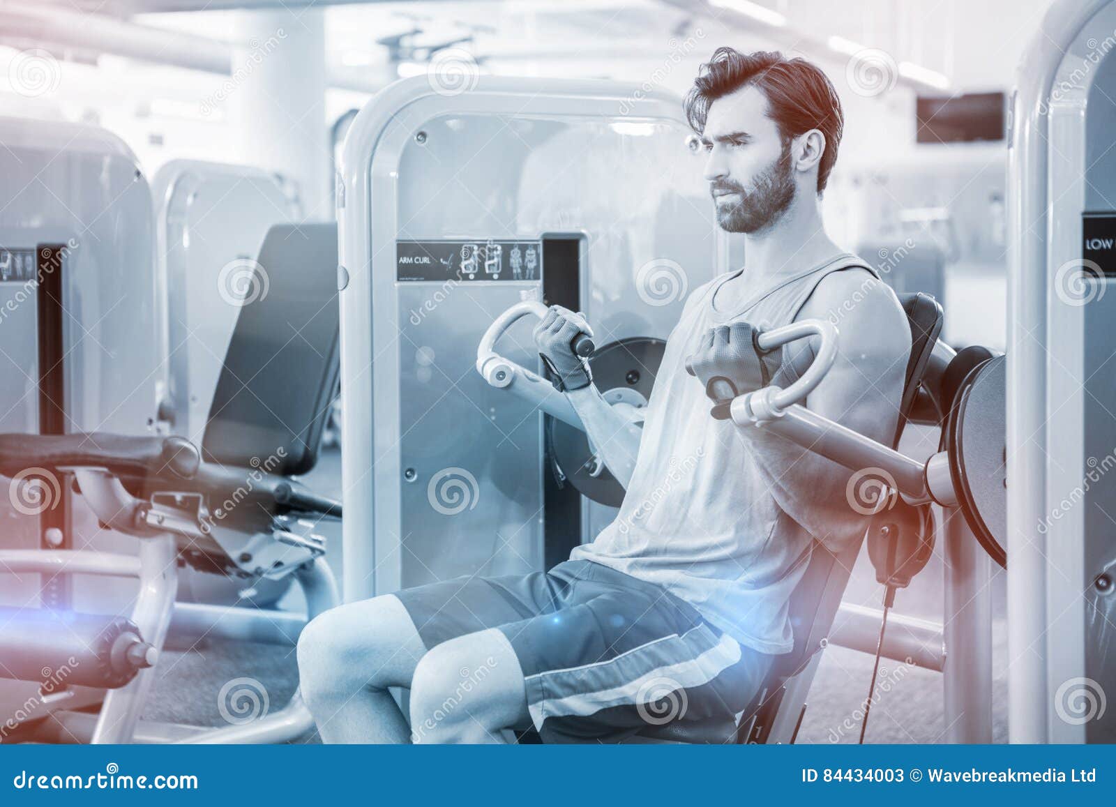 Focused Man Using Weights Machine for Arms Stock Image - Image of heavy ...