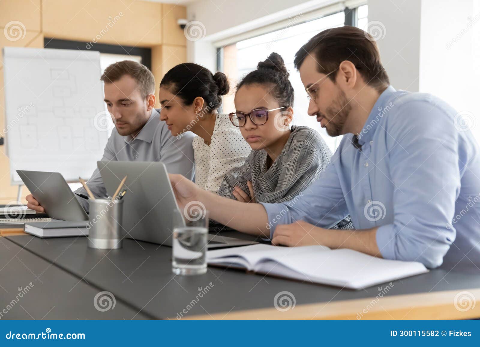 Multiethnic Employees Wok in Groups on Laptops Stock Photo - Image of ...