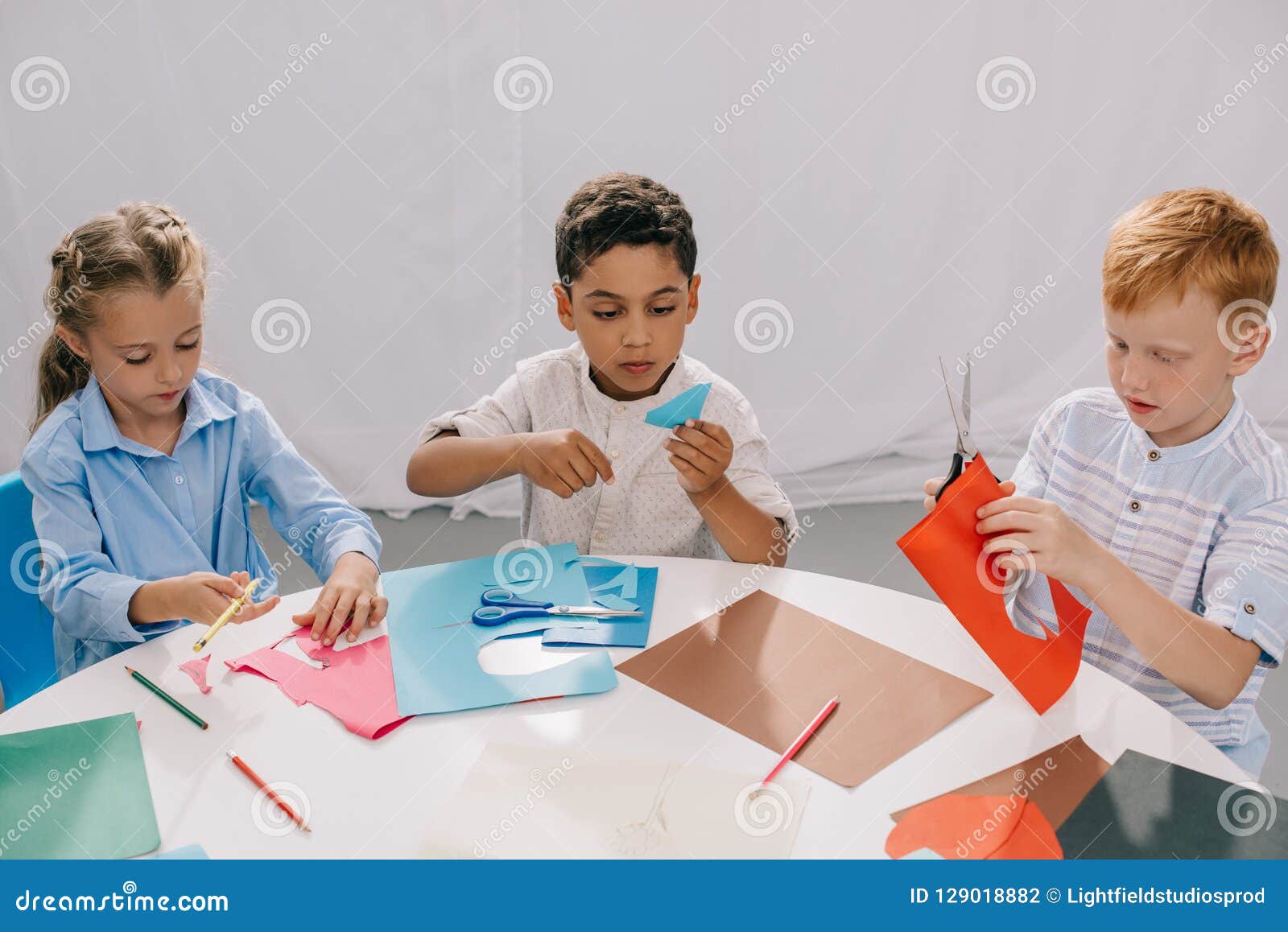 Focused Multiracial Kids Making Paper Applique Stock Photo - Image of ...
