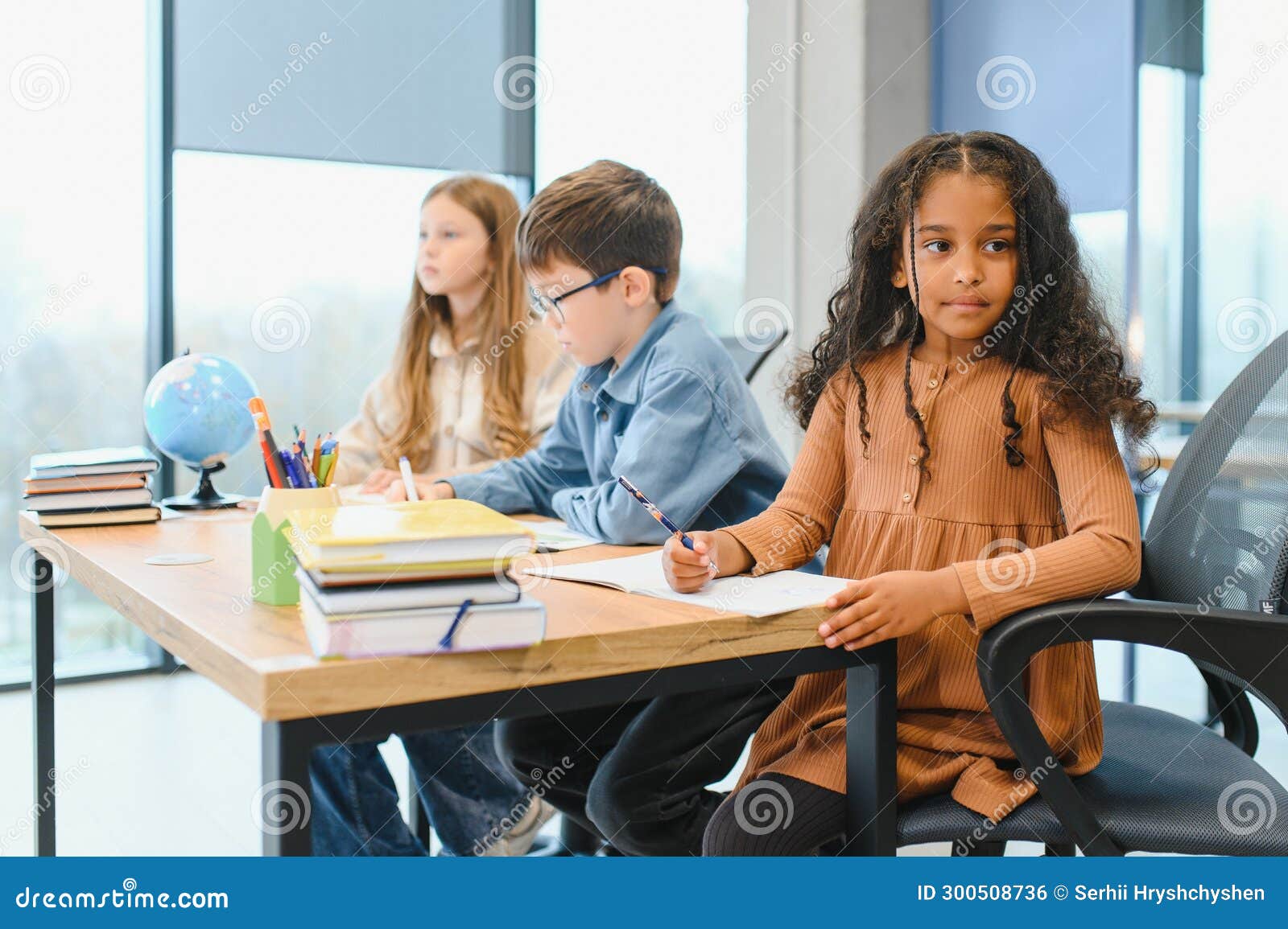 Focused Multiracial Students Kids Writing Down Data into Notebook while ...
