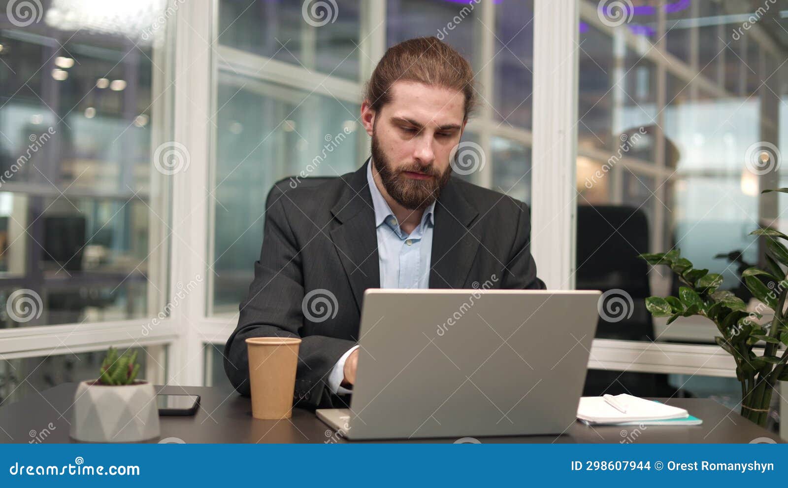 Focused Office Manager Using Modern Laptop for Work at Comfortable ...