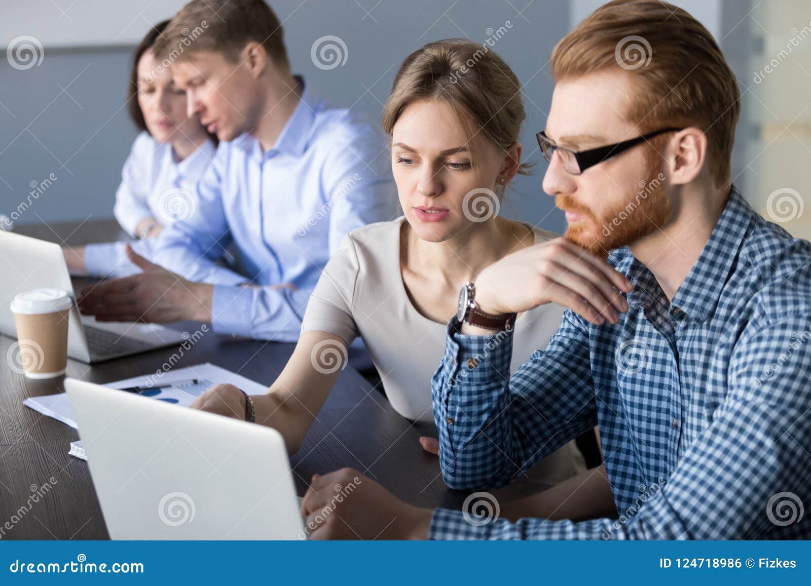 Concentrated Workers Busy at Laptops Discussing Business Project Stock ...