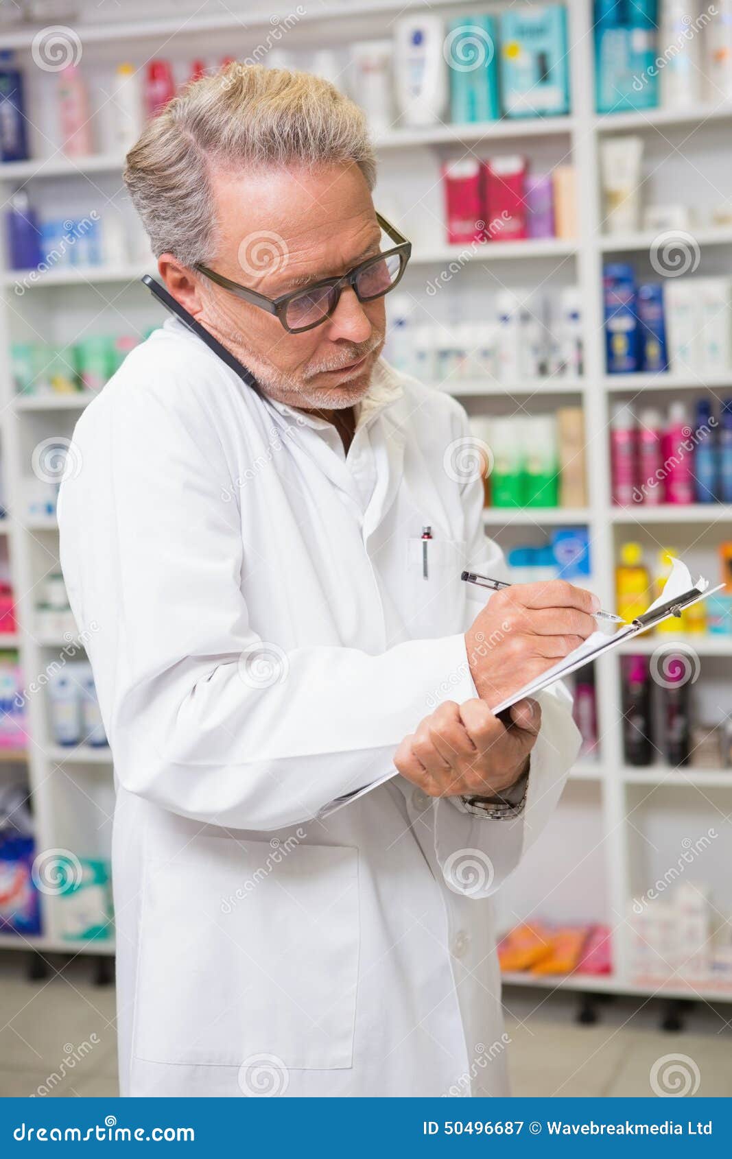 Focused Pharmacist on the Phone Taking Notes Stock Image - Image of ...