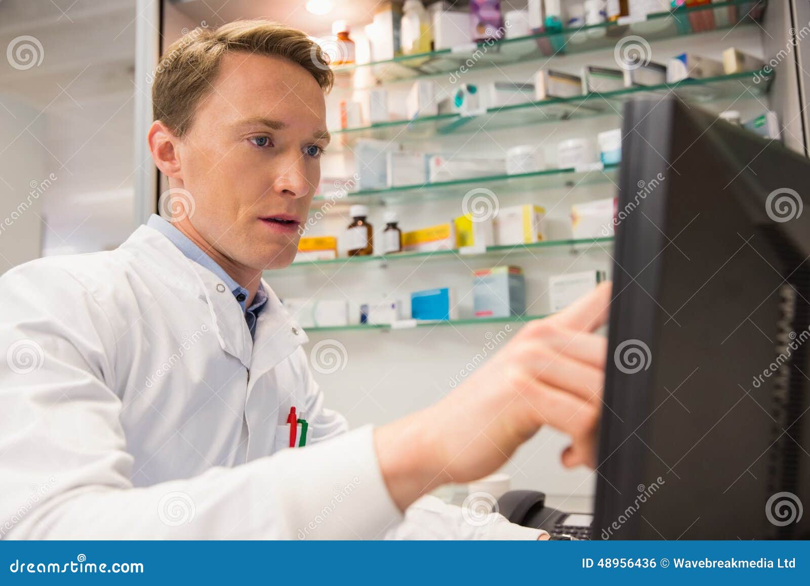 Focused Pharmacist Using the Computer Stock Photo - Image of adult ...