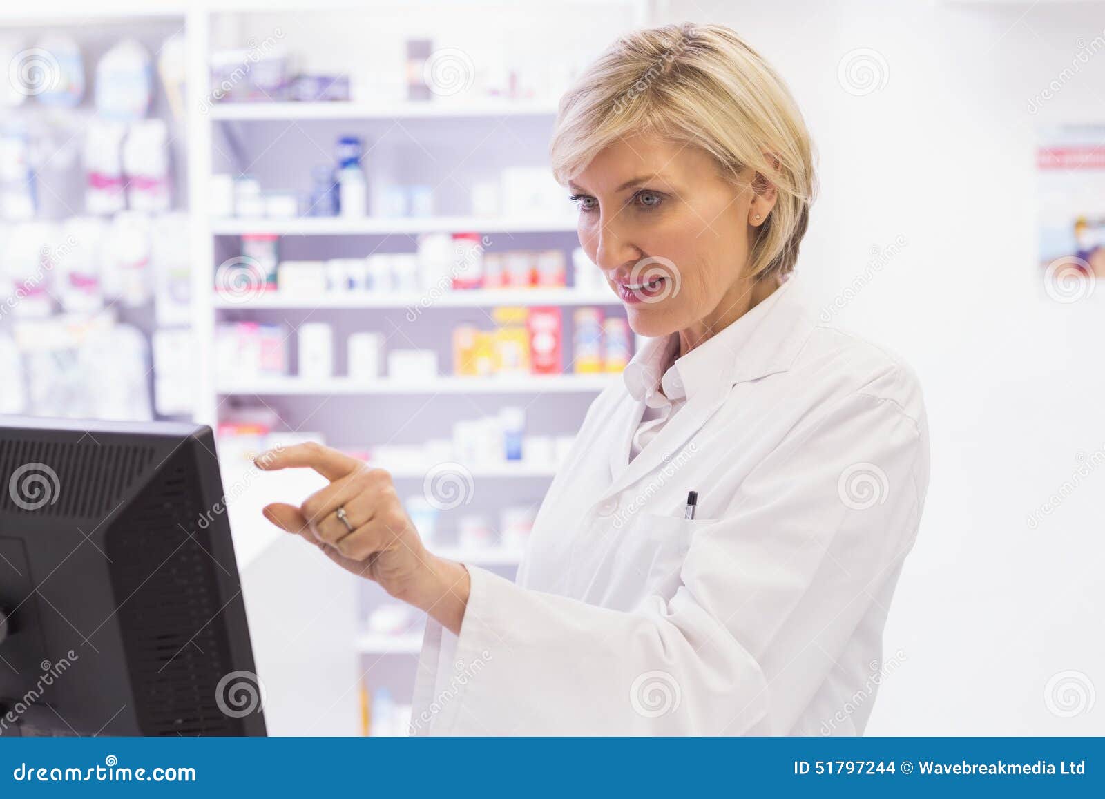 Focused Pharmacist Using the Computer Stock Photo - Image of care ...