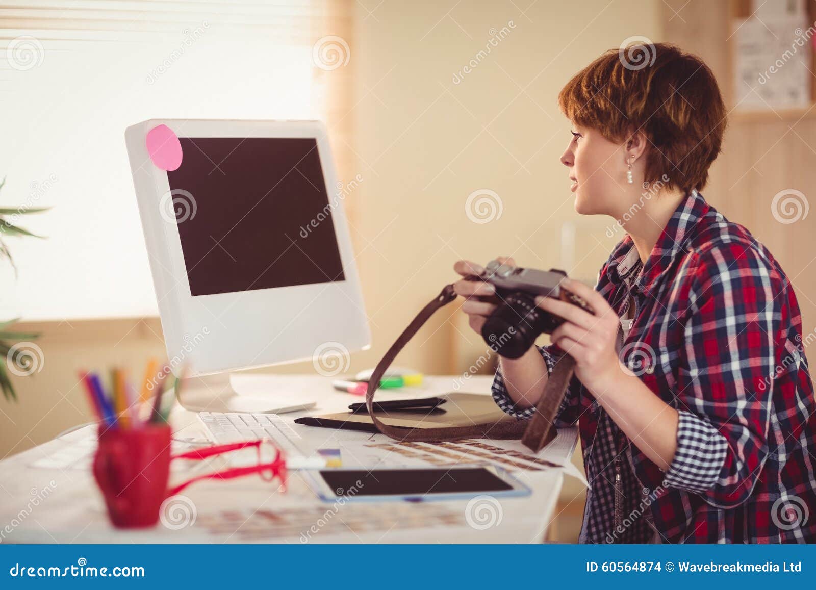 Focused Photographer Looking Pics on Her Computer Stock Photo - Image ...