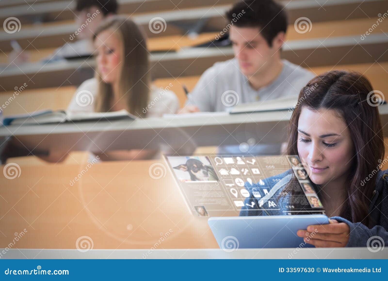 Focused Pretty Student Working on Her Futuristic Tablet Stock Photo ... Focused Pretty Student Working on Her Futuristic Tablet Stock Photo ...