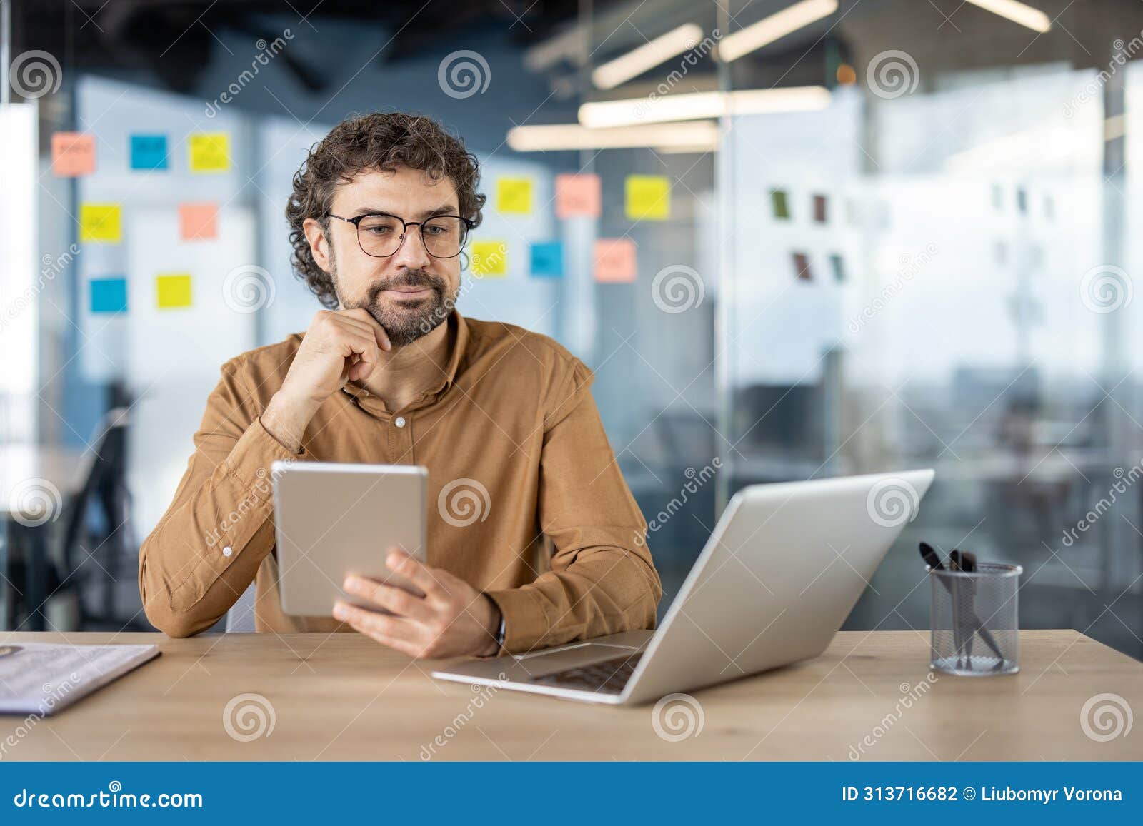 Professional Man Working Intently at a Modern Office Stock Photo ...