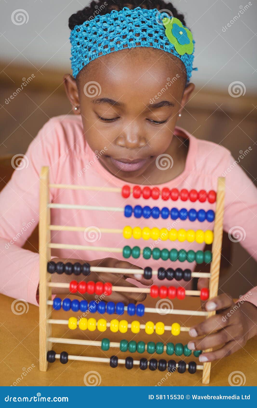 Focused Pupil Calculating with Abacus in a Classroom Stock Photo ...