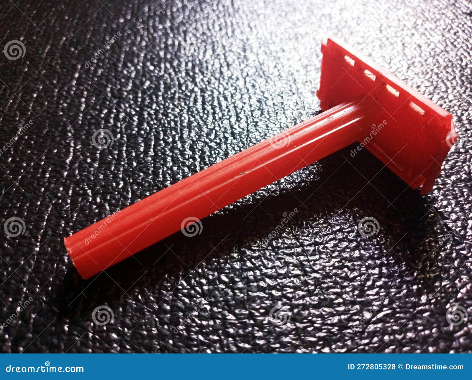 Focused Red Razor on Black Wrinkled Surface Stock Photo - Image of ...