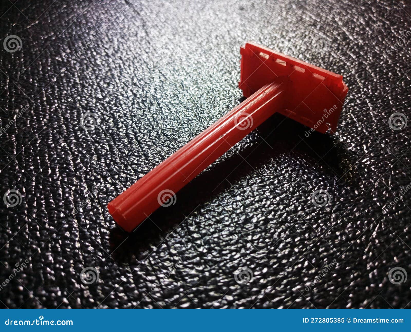 Focused Red Razor on Black Wrinkled Surface Stock Image - Image of ...