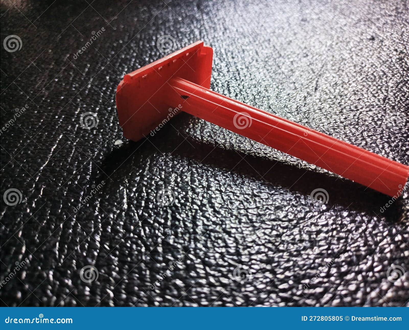 Focused Red Razor on Black Wrinkled Surface Stock Image - Image of ...