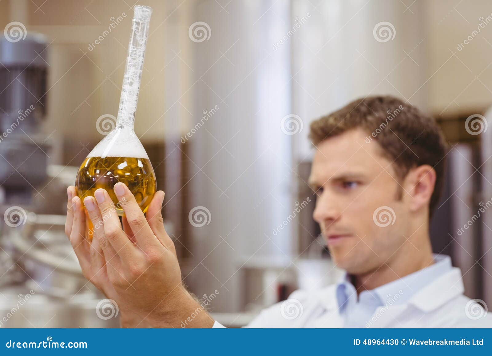 Focused Scientist Looking Beaker with Beer Stock Photo - Image of ...