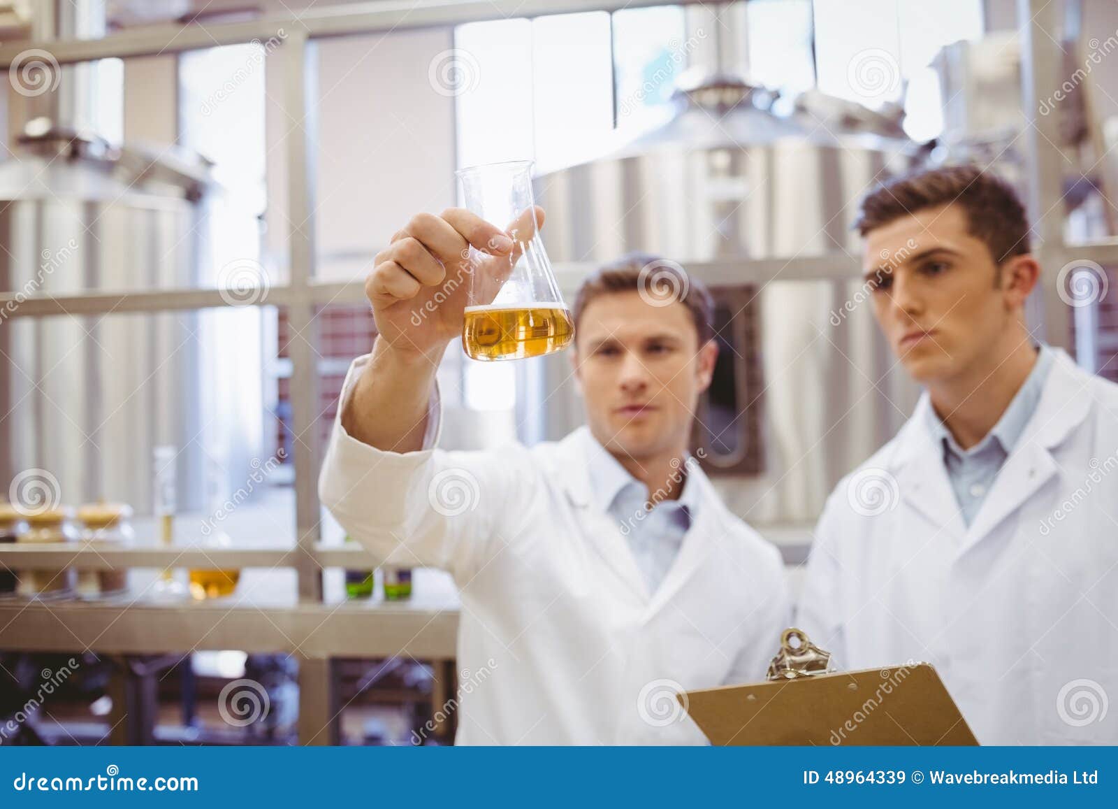Focused Scientist Team Looking at Beaker Stock Image - Image of view ...