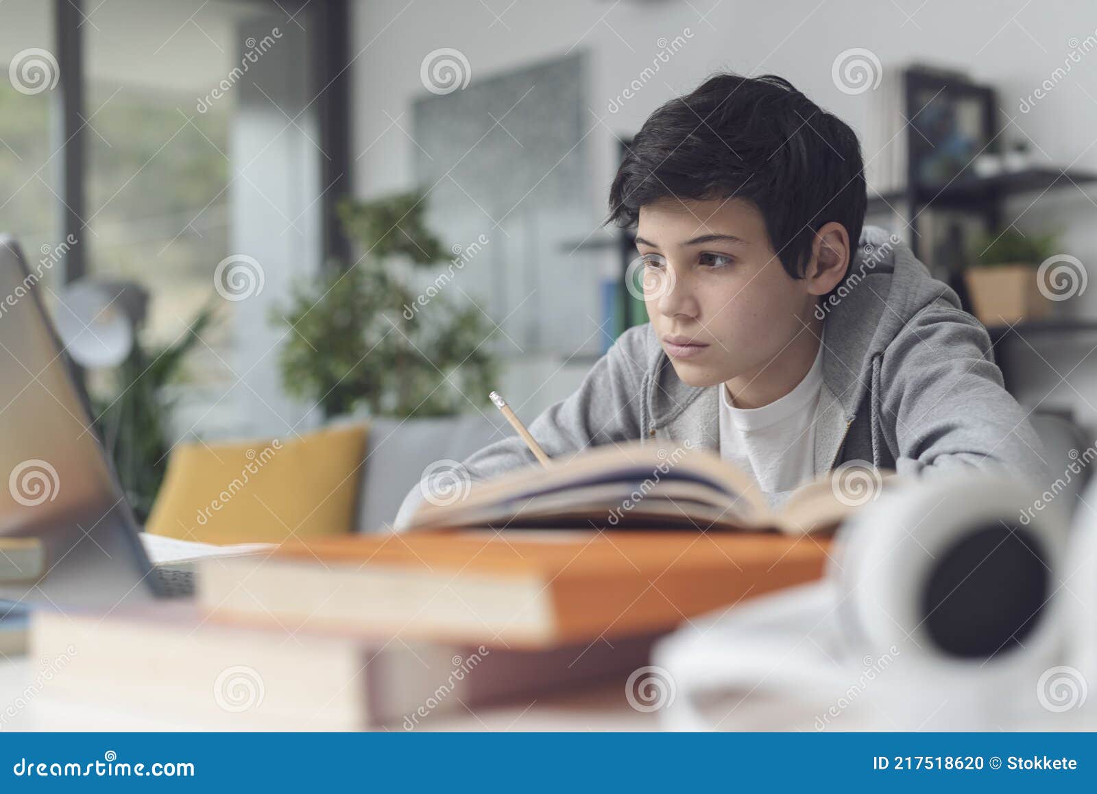 Focused Student Doing His Homework Stock Photo - Image of online ...