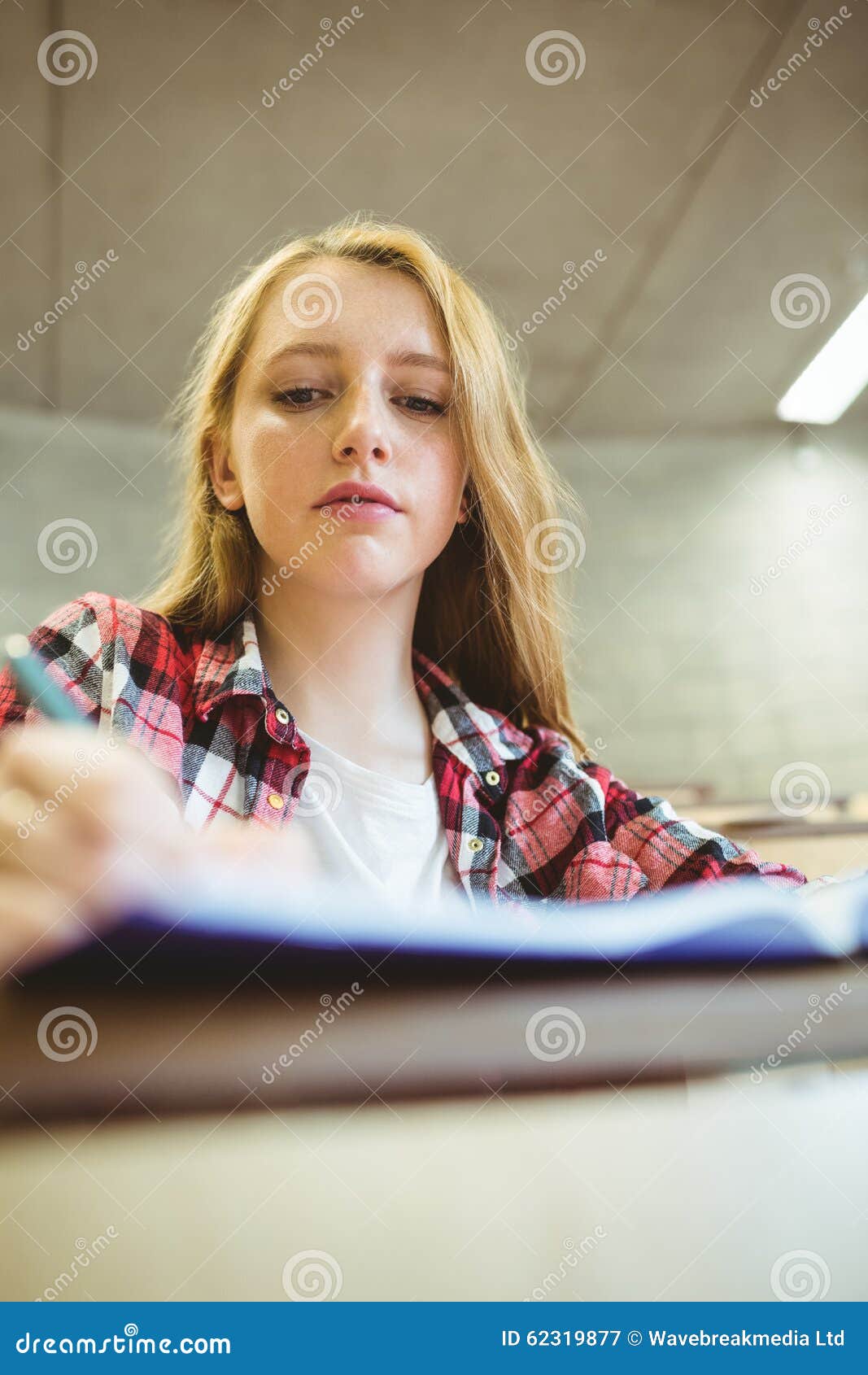 Focused Student Taking Notes during Class Stock Image - Image of female ...
