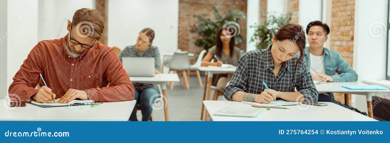 Group of University Students Taking a Test Stock Photo - Image of care ...
