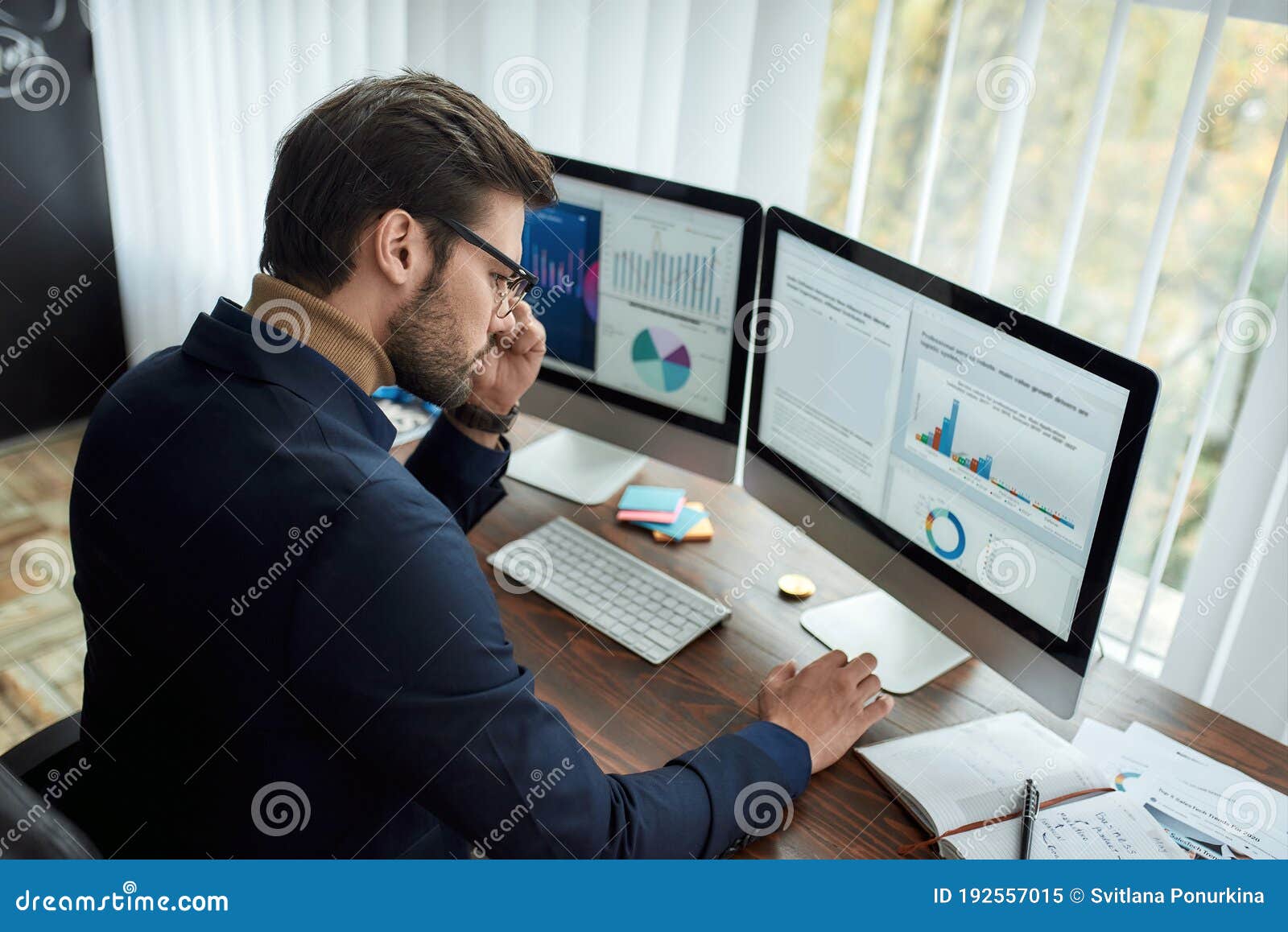 Focused Successful Businessman or Financial Analyst Working in the ...