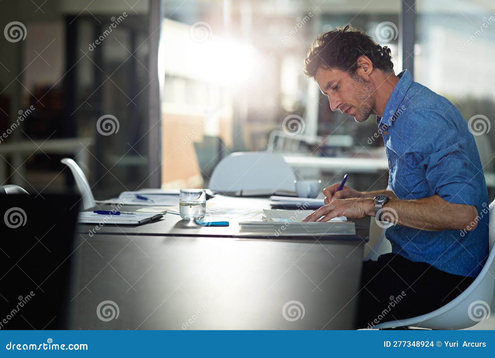 Focused on the Task in Front of Him. a Businessman Working in His ...