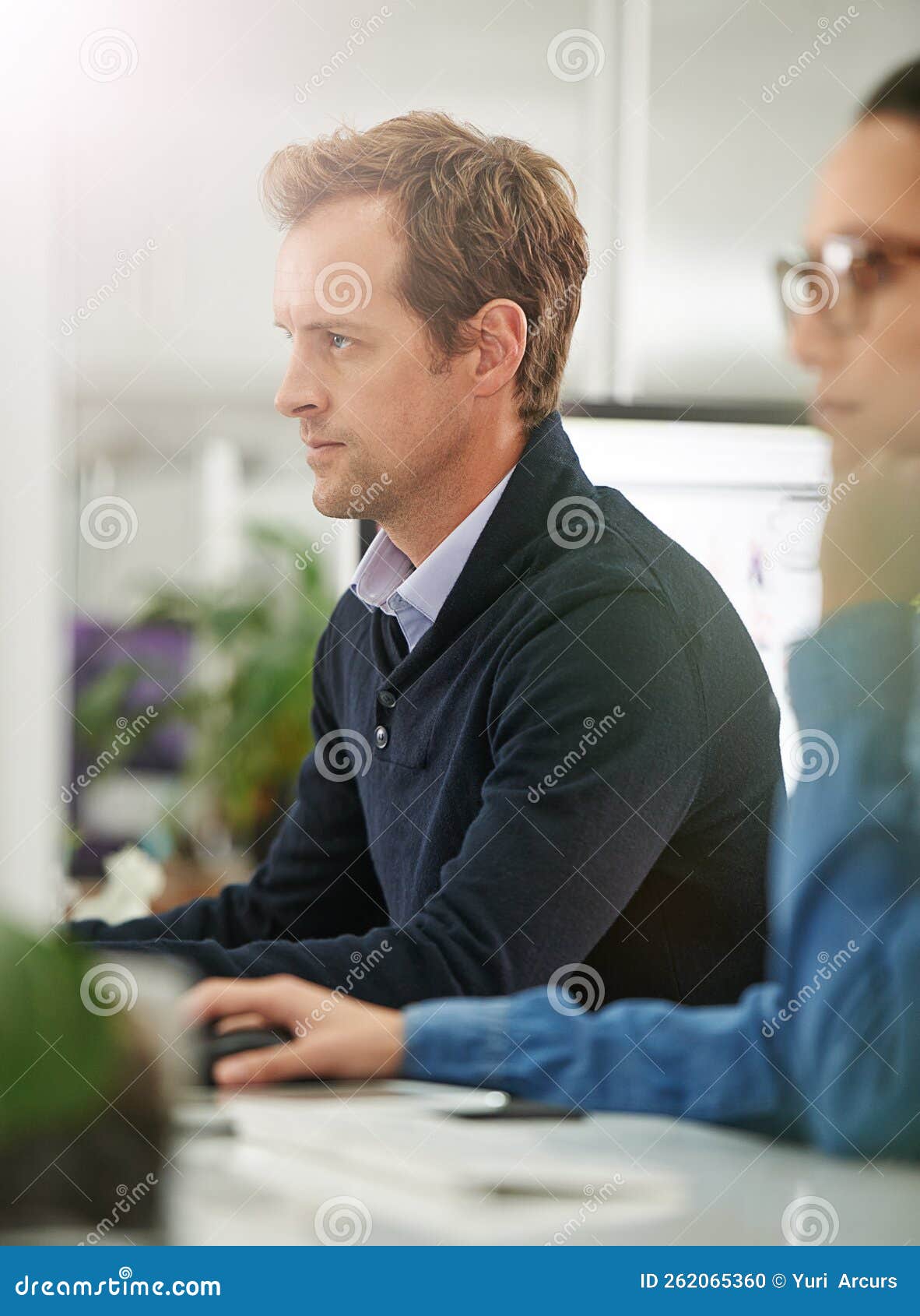 Focused on the Task at Hand. Two Colleagues at Their Desks. Stock Photo ...