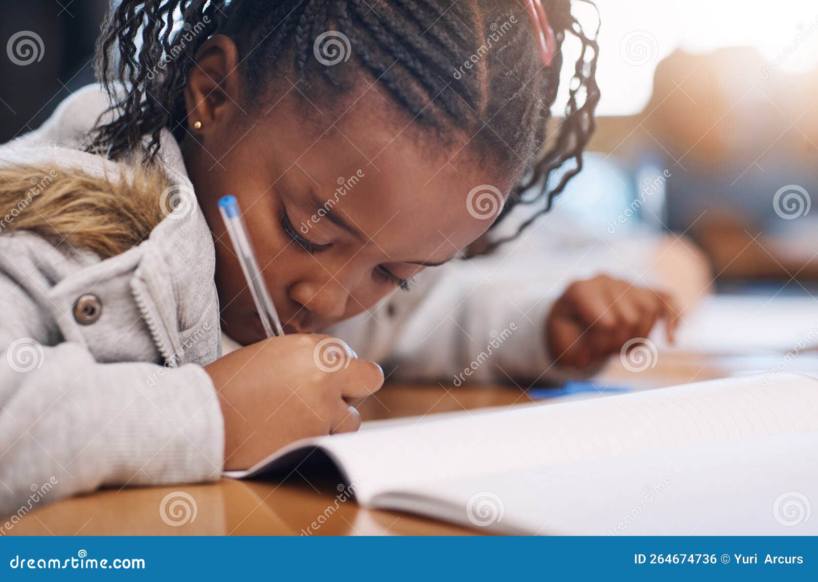 Focused on the Task the Teacher Has Given. an Elementary School Girl ...