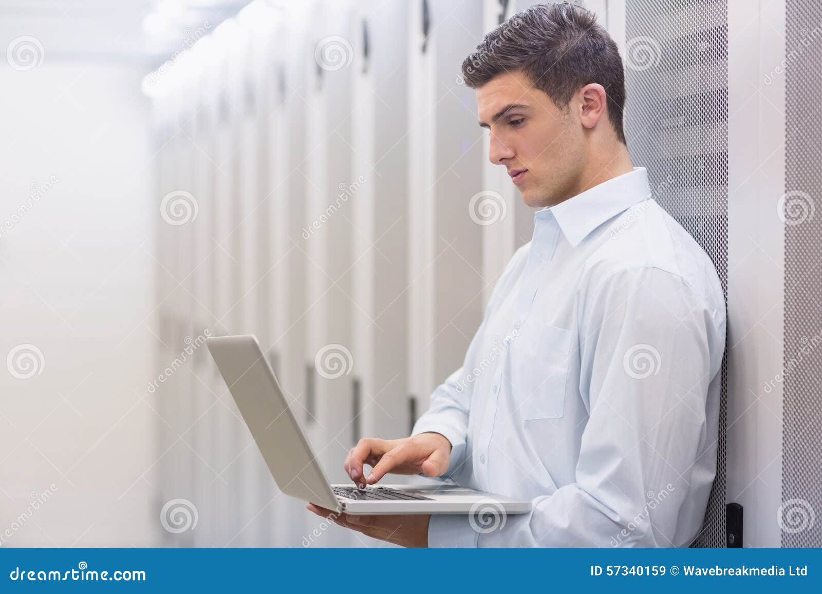 Focused Technician Typing on His Notebook Stock Image - Image of ...