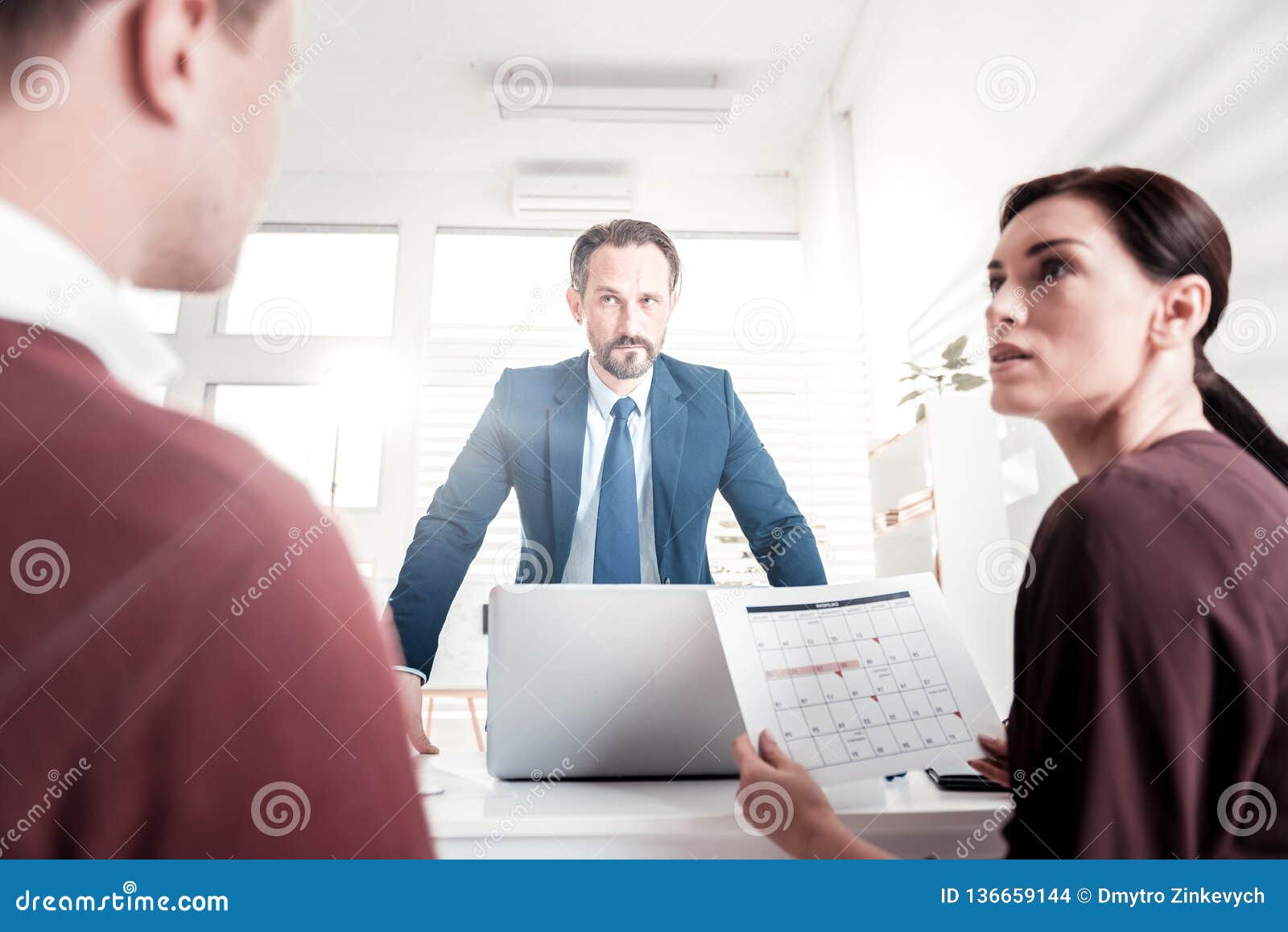 Focused Three Colleagues Facing Trouble Stock Photo - Image of ...