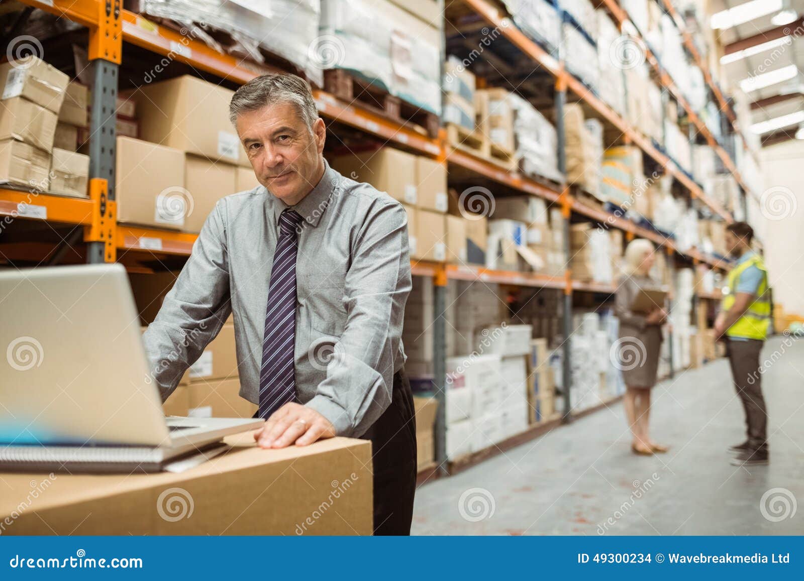 Focused Warehouse Manager Working on Laptop Stock Photo - Image of ...