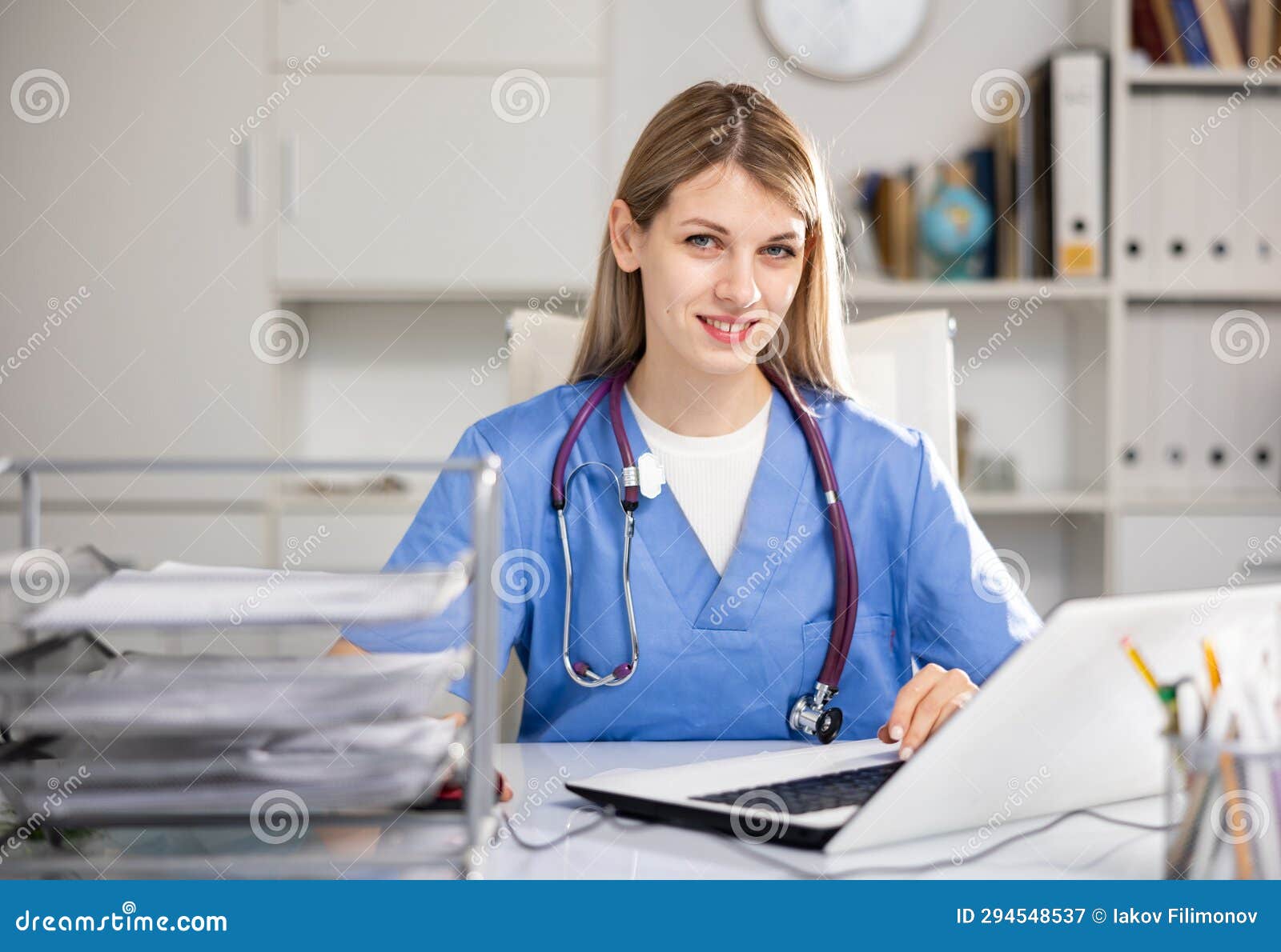 Focused Woman Doctor Working in Medical Office Using Laptop Stock Image ...