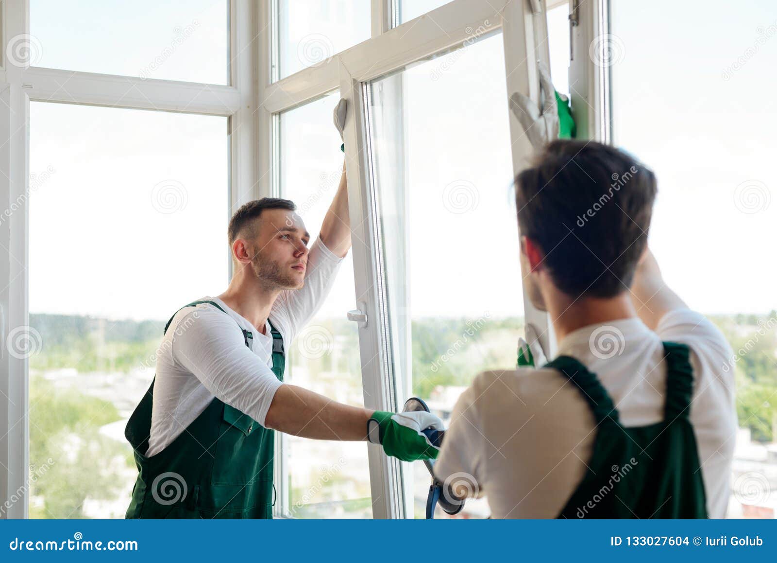 Focused Workers are Installing Windows Stock Photo - Image of building ...