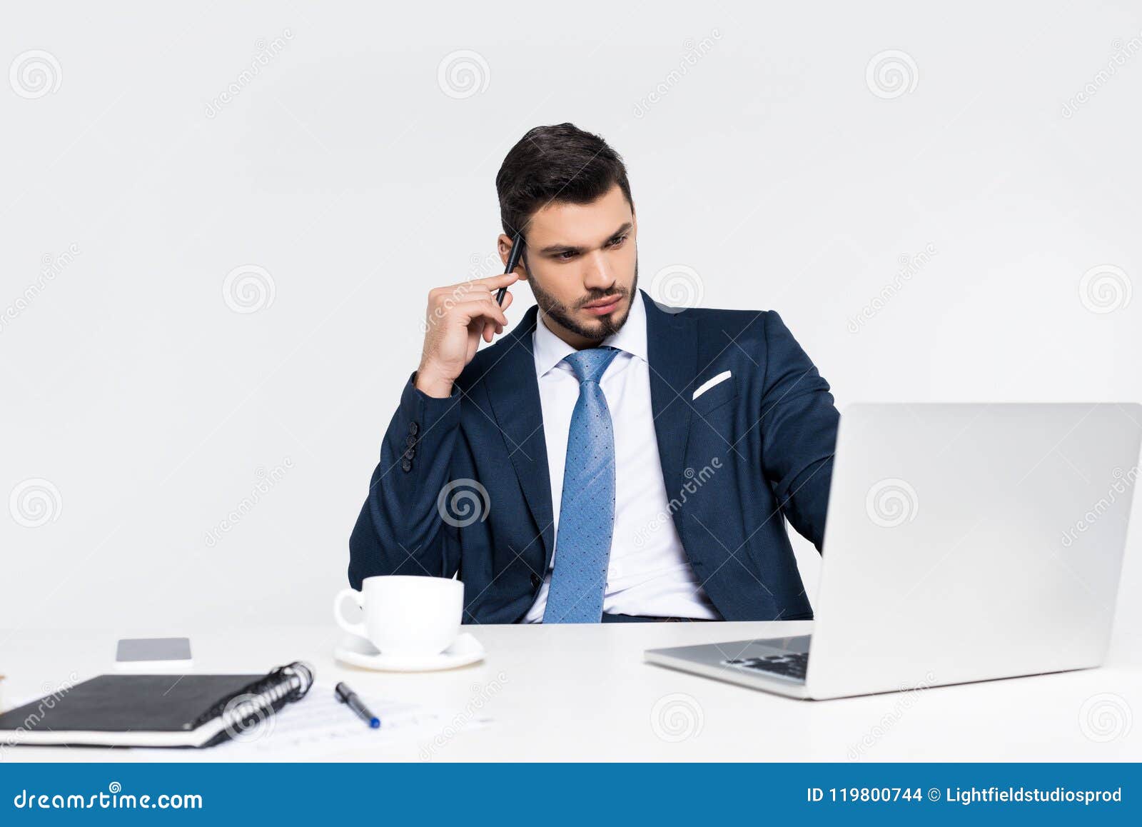 Focused Young Businessman Using Laptop at Workplace Stock Photo - Image ...
