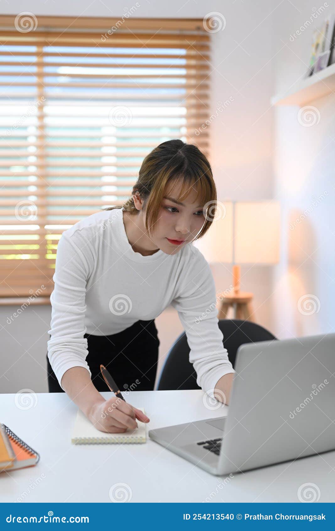 Focused Young Businesswoman Using Laptop Computer while Remote Working ...