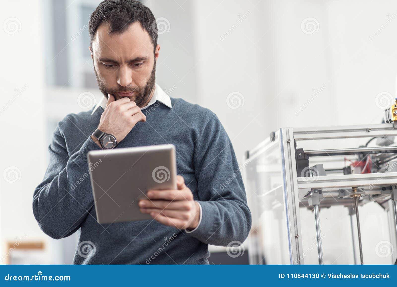 Focused Young Engineer Reading from Tablet Stock Photo - Image of creative, creativity: 110844130