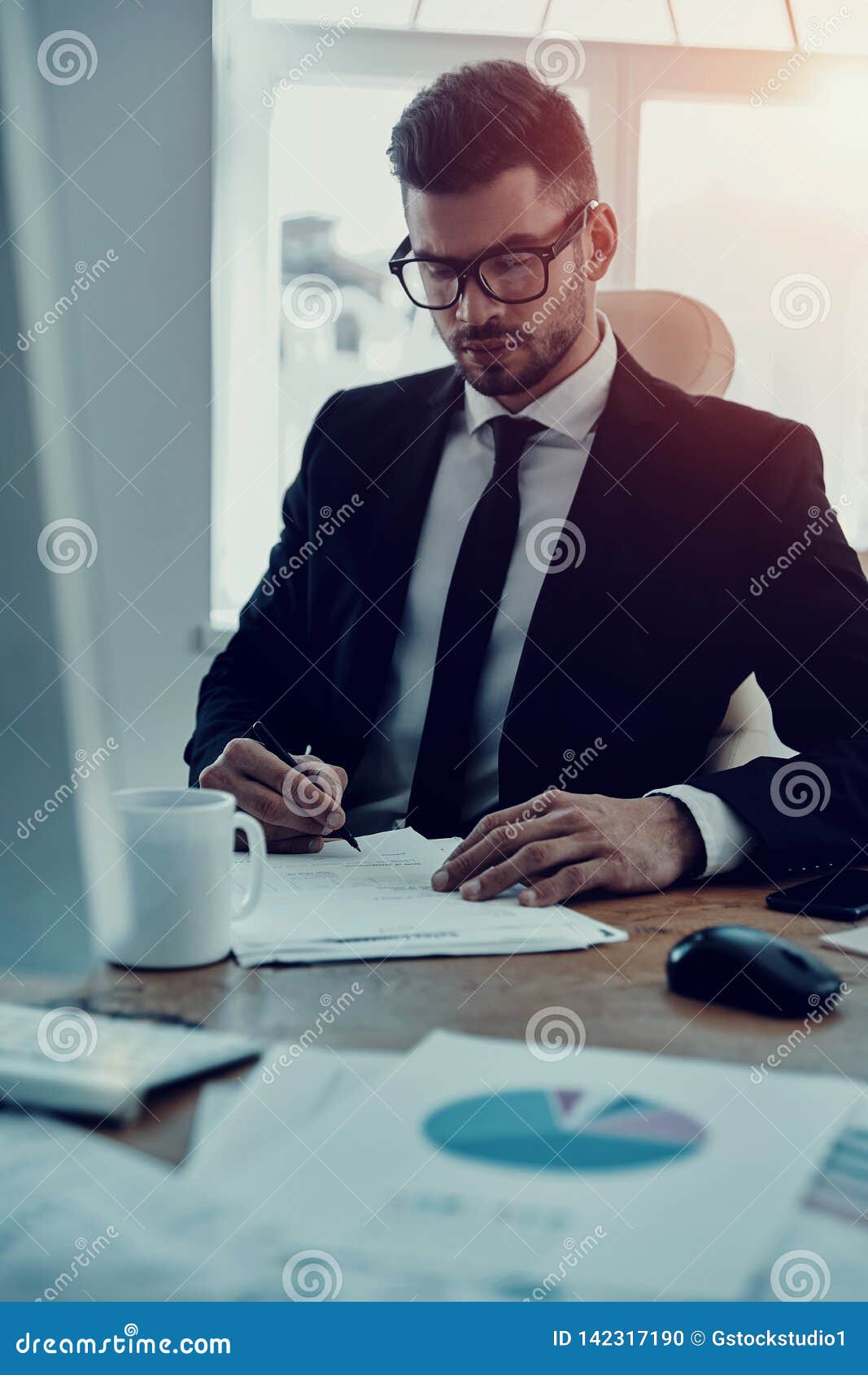 Focusing on work. stock photo. Image of adult, filling - 142317190