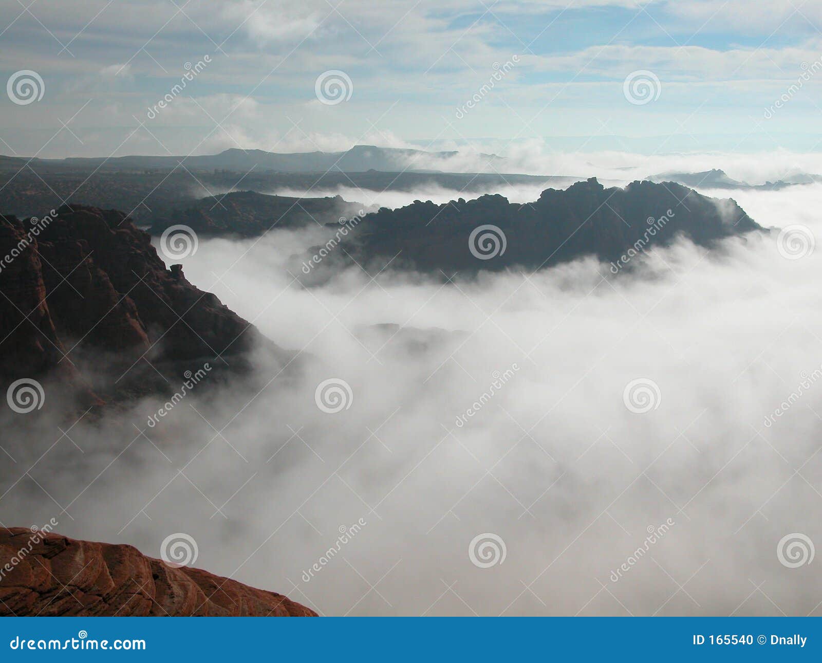 Fog Choking the Red Desert stock photo. Image of canyon - 165540