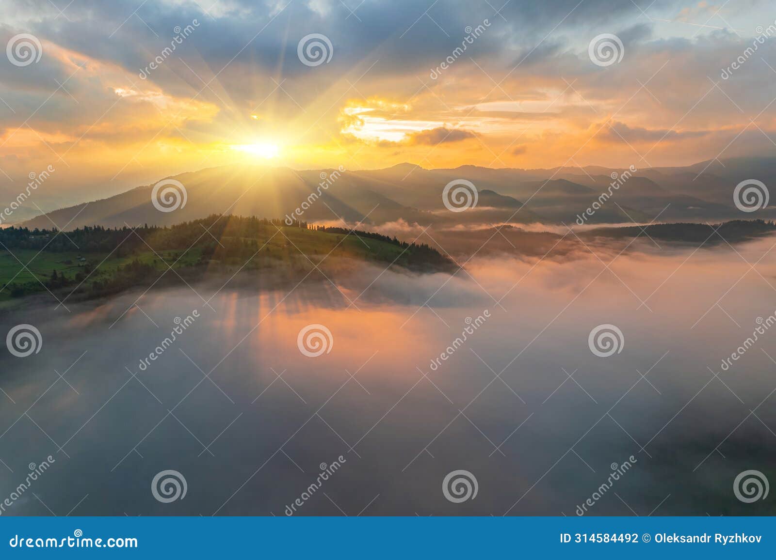 Fog Envelops the Mountain Forest. the Rays of the Rising Sun Break ...