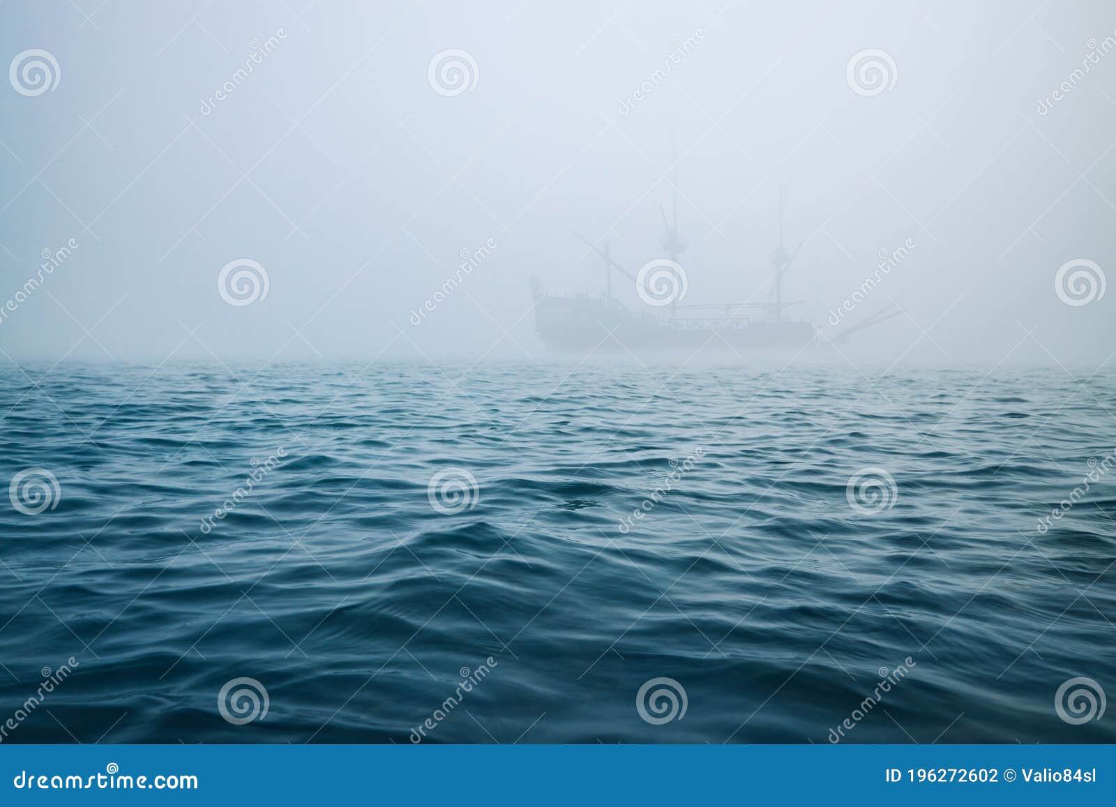Fog Over the Sea Waves, and Misty Ship on a Background Stock Photo ...
