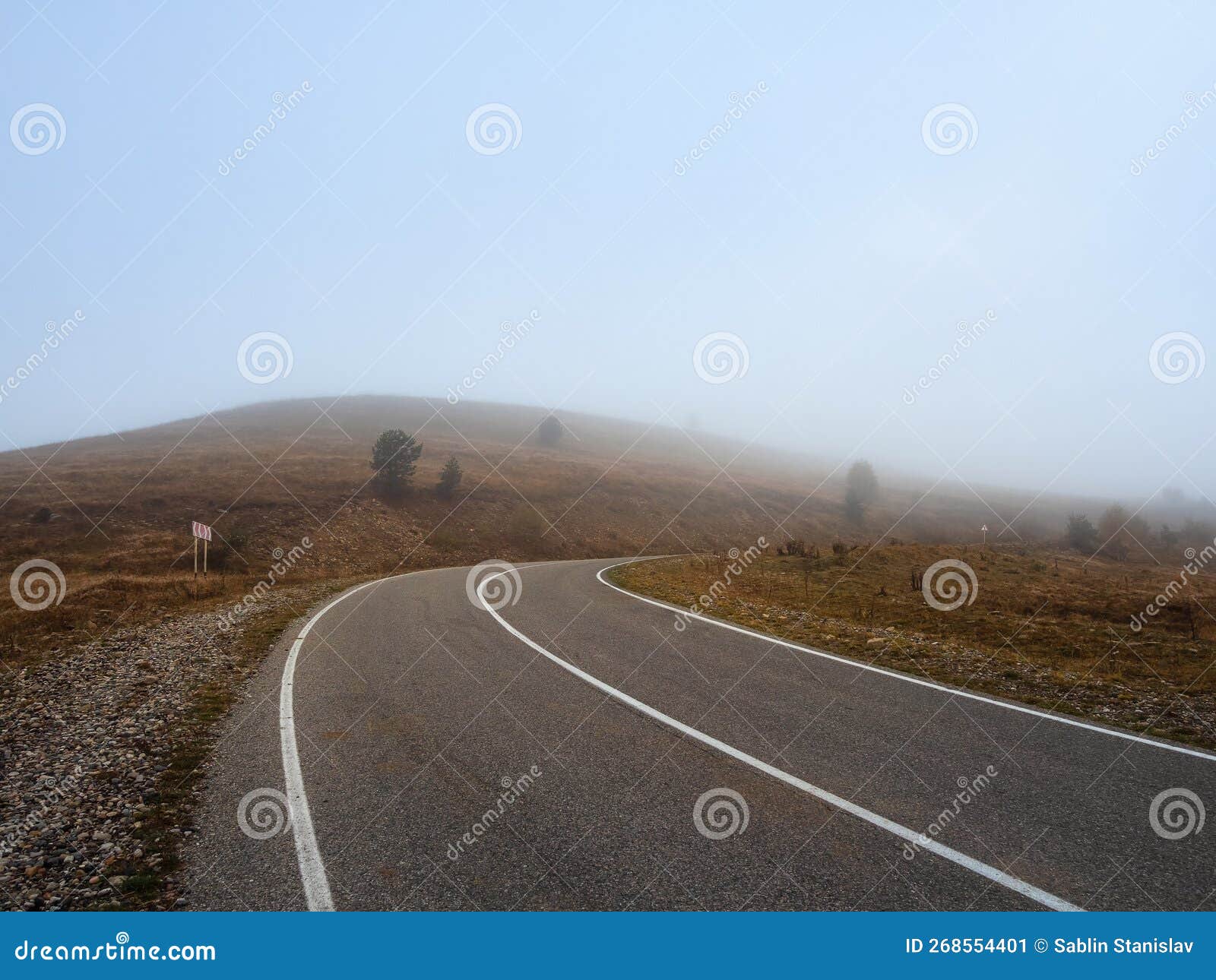 Foggy Empty Highway Up through the Pass. Road through a Dense Fog Stock ...